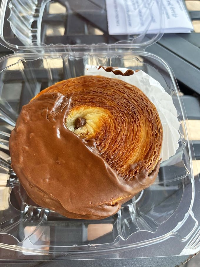 A chocolate croissant so perfectly laminated it belongs in a pastry museum, not your stomach.
