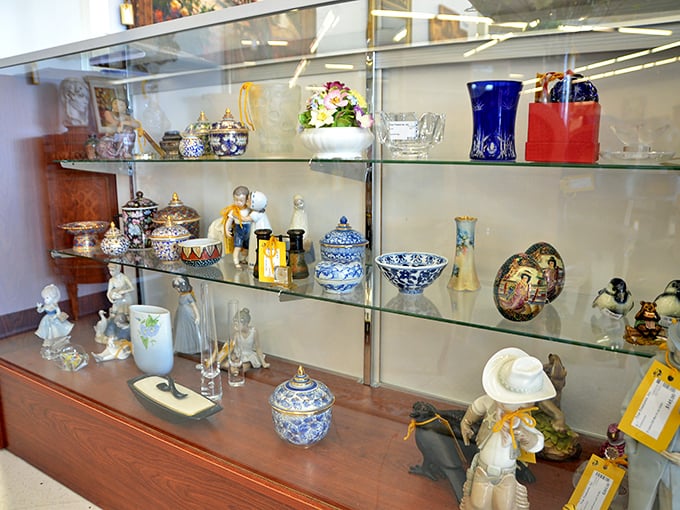 The curio cabinet—where collectibles large and small await adoption. That blue and white porcelain has "sophisticated beach house" written all over it.