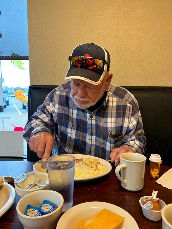 Where regulars become family and first-timers become regulars. This gentleman knows exactly what he's doing—breakfast at The Grove is serious business.