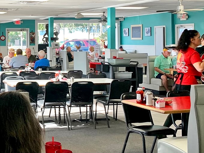 The dining room hums with the energy of locals and lucky tourists. Notice the lack of phones—real conversation happens when the food demands full attention.