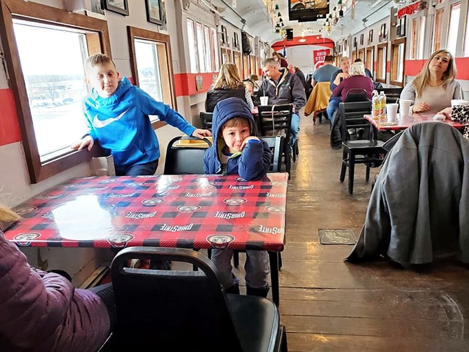 Families gather in the narrow dining car, where every meal becomes an adventure and children peek excitedly out windows that once framed America's landscapes.