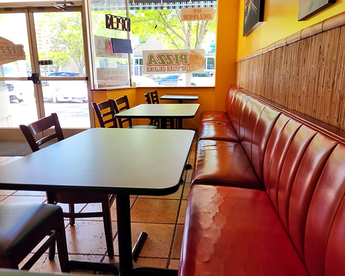Red vinyl booths and formica tables – the unofficial uniform of places that prioritize flavor over fashion. Comfort never goes out of style.