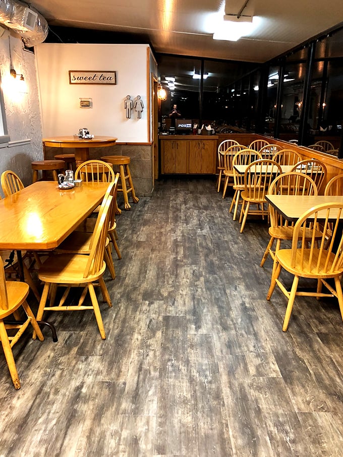 The dining area feels like a nostalgic trip to simpler times. Those wooden Windsor chairs have witnessed countless "Oh my god, you have to try this" moments.