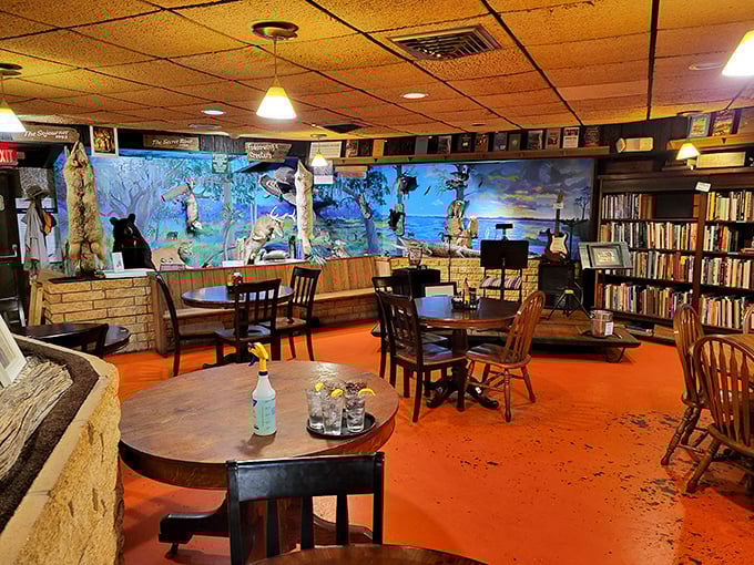 The dining room feels like your eccentric Florida aunt's living room—if she collected books, taxidermy, and had impeccable taste in comfort food.