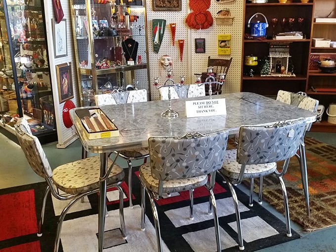 This chrome and Formica dining set isn't just furniture—it's a time machine to 1950s breakfast nooks where families planned their American Dreams.