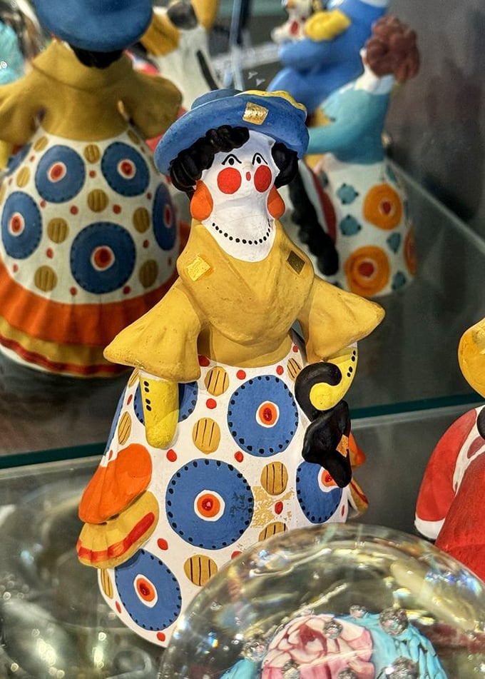 This whimsical polka-dotted figurine isn't just decoration—it's the conversation starter your bookshelf has been desperately waiting for.