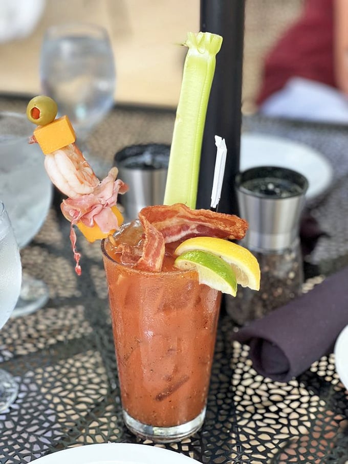 Not your average Bloody Mary—this is breakfast, appetizer, and cocktail in one magnificent glass. That bacon garnish isn't just for show.