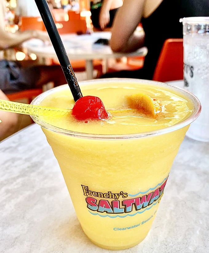 Liquid sunshine in a glass! This tropical concoction, adorned with cherry and pineapple, promises vacation vibes with every sip—no plane ticket required.