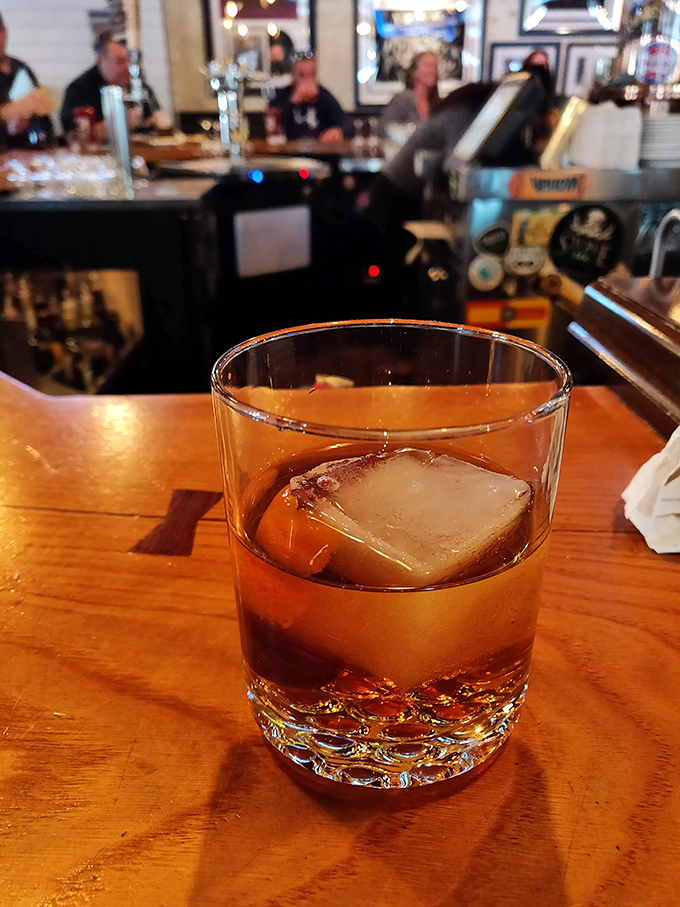 A perfectly poured whiskey with one substantial ice cube – civilization's answer to Monday meetings, traffic jams, and smartphone updates.