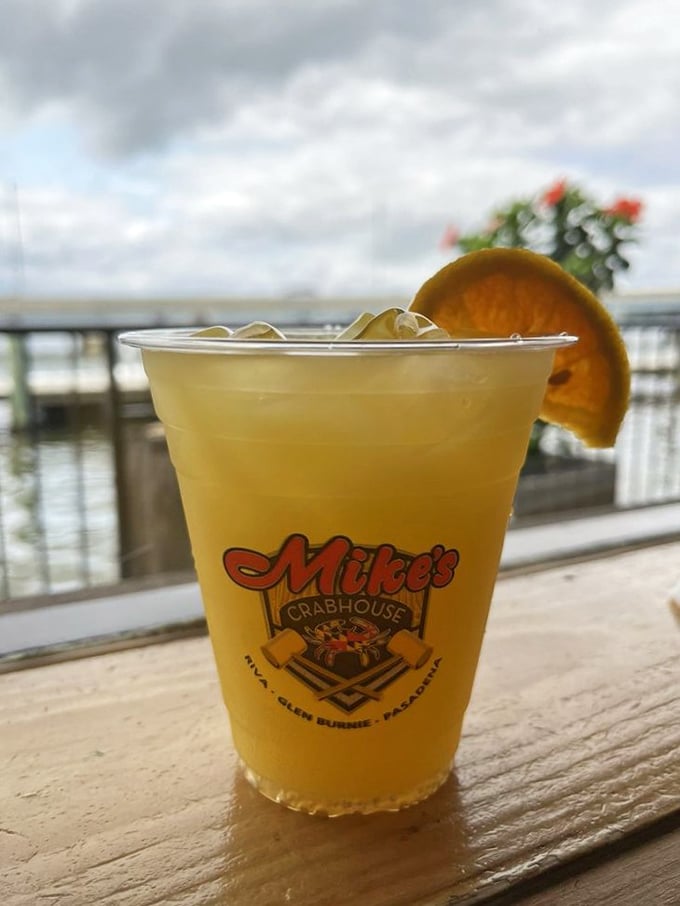 Waterfront views and a cold drink in a Mike's Crabhouse cup—sometimes the simplest pleasures make the most profound memories.
