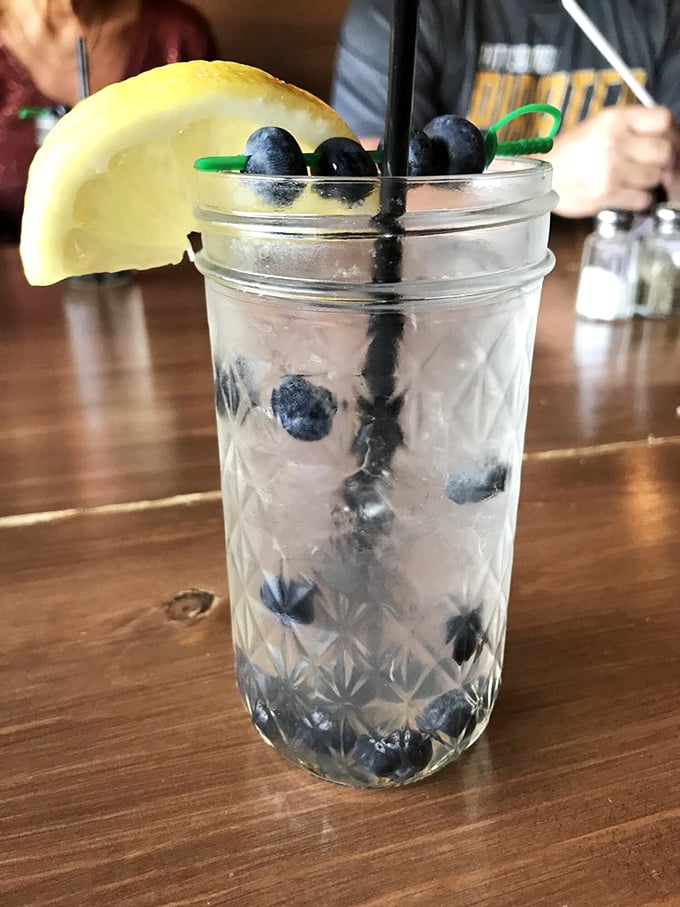A mason jar cocktail that's both refreshing and photogenic—blueberries and lemon creating that perfect summer in a glass experience.
