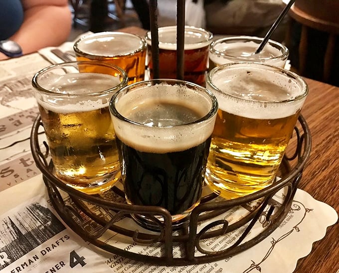 A flight of German beers arranged like a liquid color wheel—from golden pilsners to that center stout that's darker than my coffee this morning.