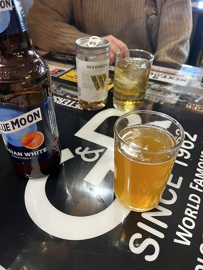 Cold beer in unpretentious glassware—the perfect companion to cut through the richness of that famous bologna. Sometimes happiness is this straightforward.