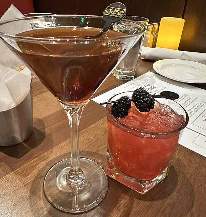 Cocktails that dress better than most people. That blackberry garnish isn't just for show—it's the exclamation point on liquid poetry.
