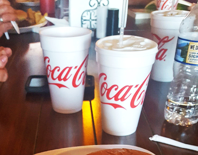 Classic Coca-Cola in those iconic cups—because sometimes the perfect burger deserves a sidekick that's been getting it right since 1886.