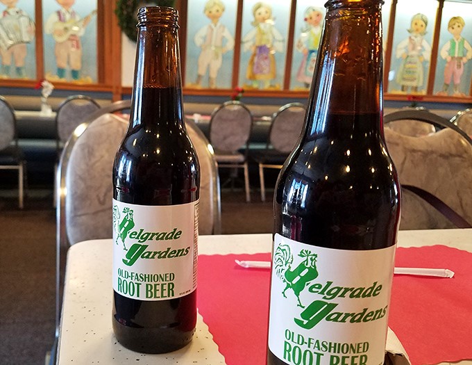 Old-fashioned root beer in glass bottles—because sometimes the perfect beverage pairing isn't about alcohol content but childhood nostalgia.