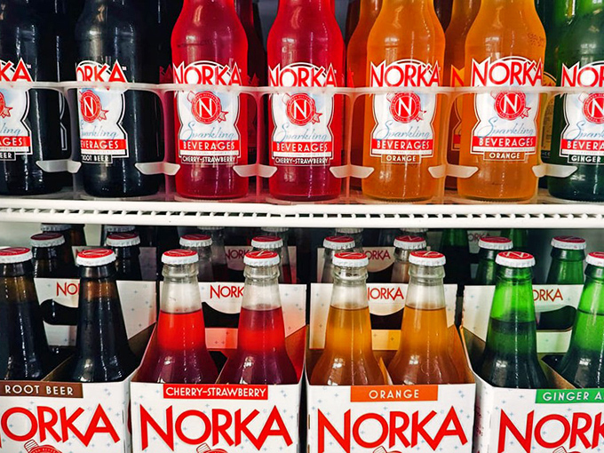 Norka sodas lined up like colorful soldiers ready for duty. Because local pizza deserves a local beverage companion.
