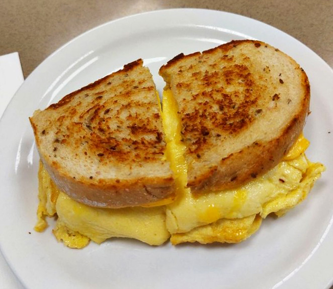 Breakfast perfection doesn't need to be complicated—just melty cheese hugging fluffy eggs between toasty bread that's been kissed by the griddle.