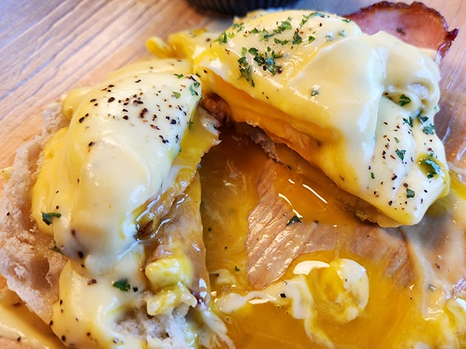 The eggs Benedict here doesn't just break yolks—it breaks expectations, with that hollandaise sauce performing small miracles on an English muffin stage.
