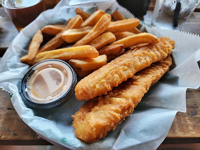 Fish and chips that would make a British pub-goer weep with joy – golden, crispy batter surrounding flaky white fish alongside perfectly fried potatoes.