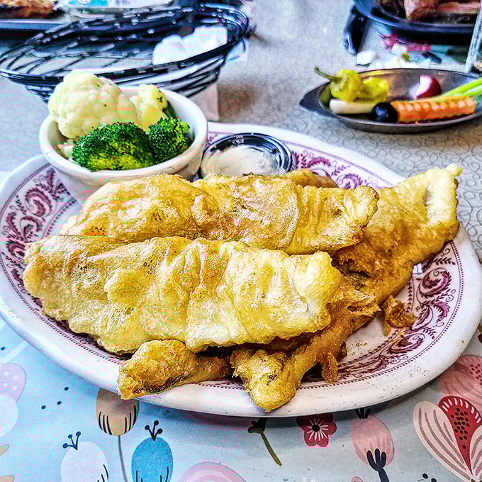 Golden-battered fish that shatters at first bite, served with vegetables that remind you that balance in all things—even indulgence—has merit.