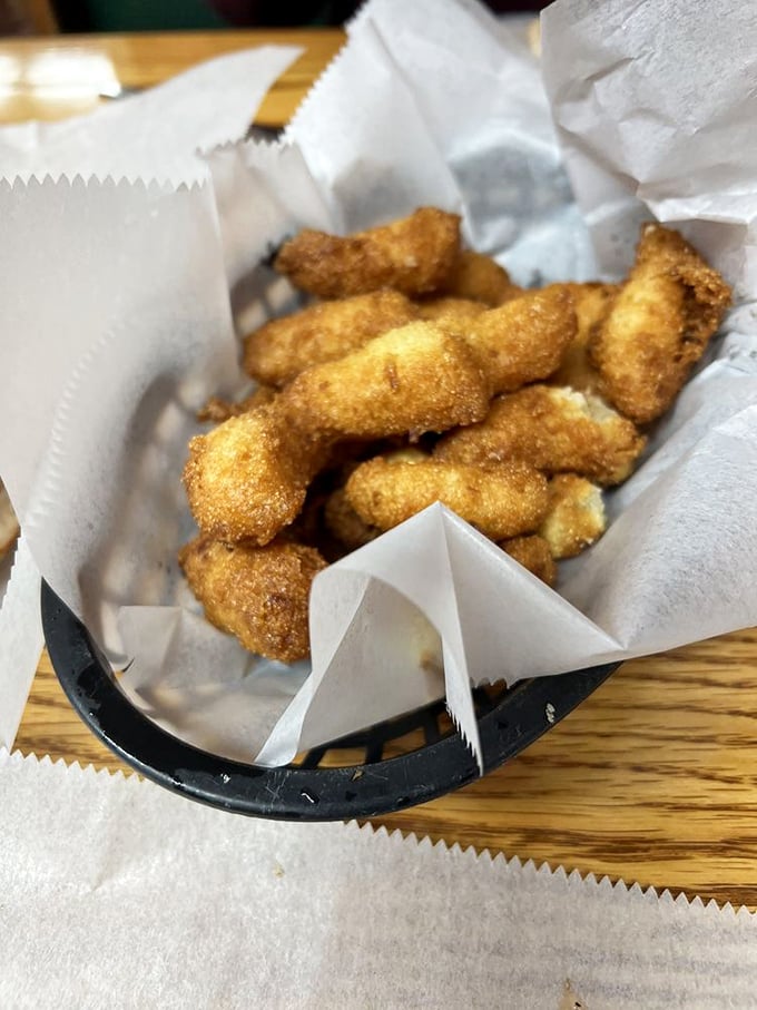 Crispy outside, fluffy inside—these hush puppies have mastered the art of textural contradiction.