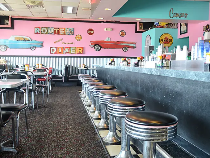 The counter seating offers front-row tickets to the breakfast show. Those chrome stools have witnessed countless coffee refills and life-changing food decisions.