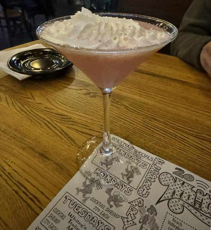 That's not just a cocktail—it's a pink cloud of possibility resting in a martini glass, waiting to make your evening extraordinary.