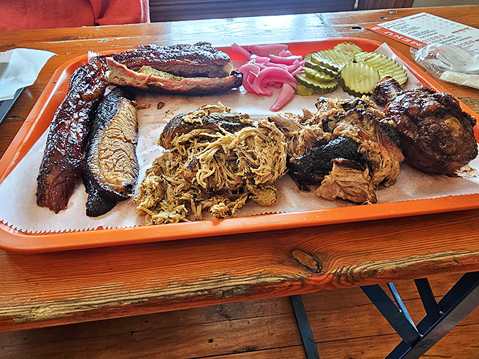 The barbecue United Nations—where different meats gather in peaceful, delicious harmony. That pickle provides diplomatic immunity from richness overload.