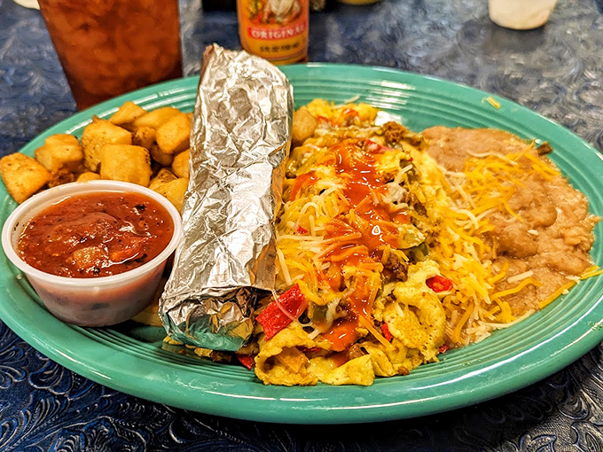 Breakfast goes technicolor with this Tex-Mex fiesta plate. Those potatoes aren't just a side – they're little crispy supporting actors in this morning drama.