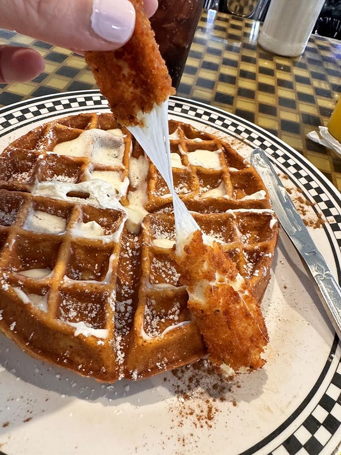 Waffle architecture at its finest! Crisp exterior, fluffy interior, and that pull of melted butter – breakfast engineering that deserves a standing ovation.
