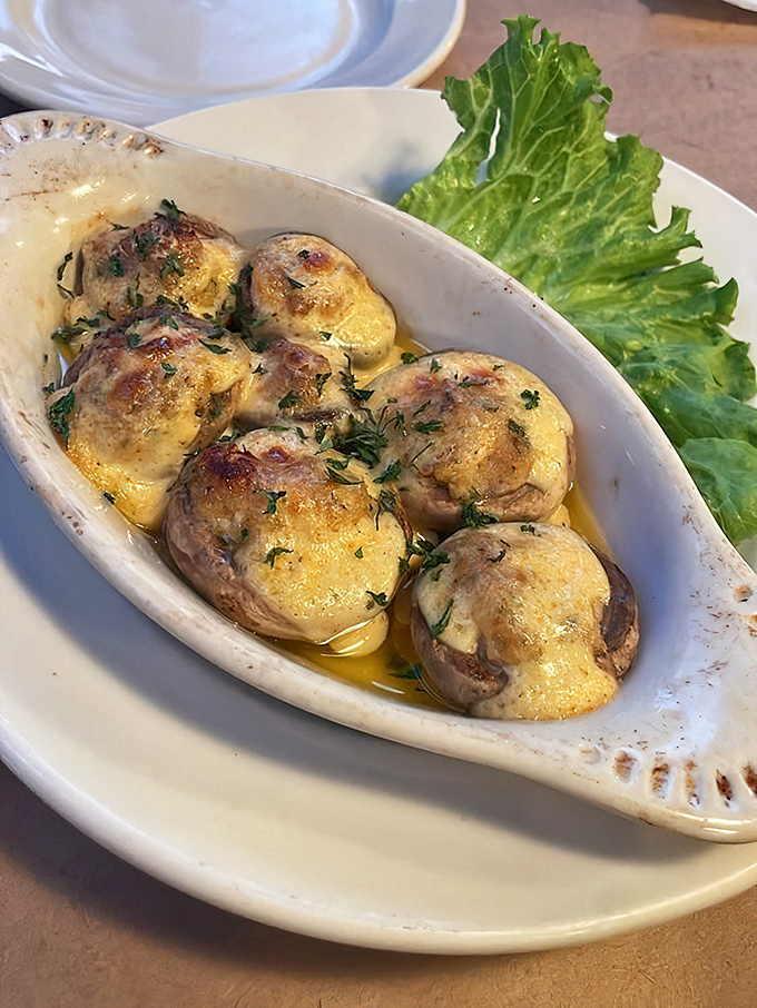 These stuffed mushrooms aren't just side players—they're headliners, swimming in buttery goodness and topped with herbs that mean business.