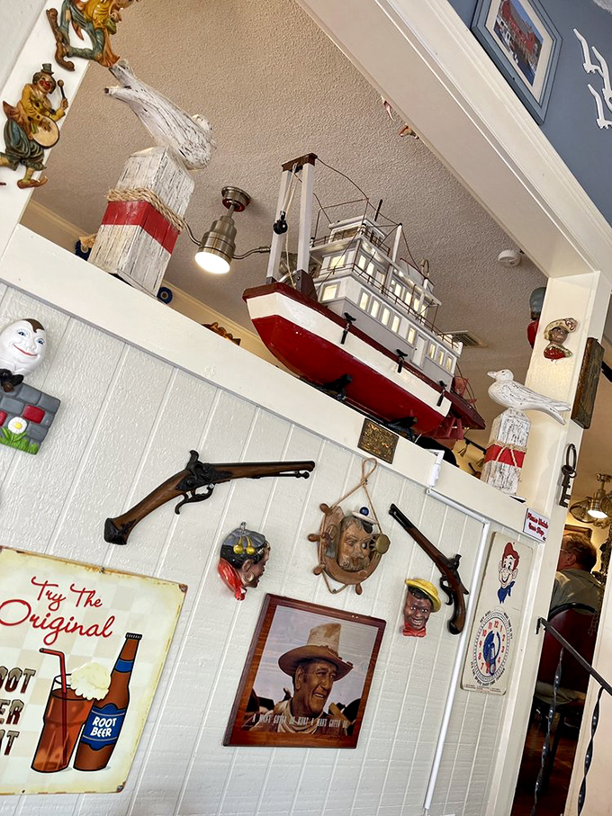 The décor tells sea tales without saying a word. That model ship probably witnessed more food euphoria than actual nautical miles.