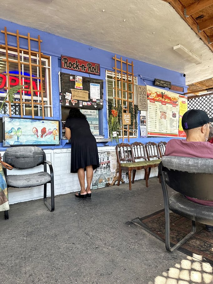The ordering window – that magical portal where dreams are placed and delicious realities emerge. The "Rock-n-Roll" sign hints at the flavor party about to happen.