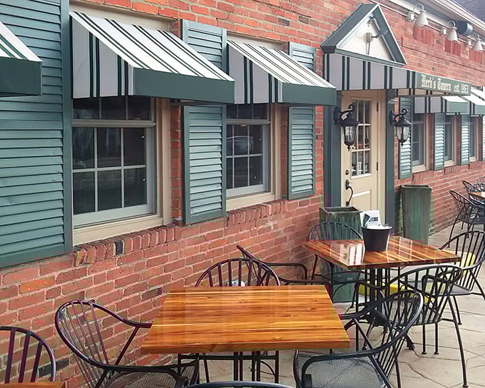 The outdoor patio—where summer afternoons stretch into evening conversations and strangers become friends over cold drinks.
