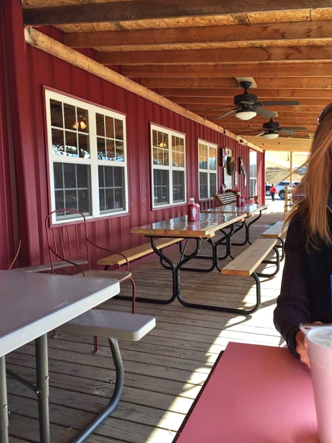 The covered porch at Jim's isn't just outdoor seating—it's a front-row ticket to mountain air and the symphony of satisfied sighs from fellow diners.