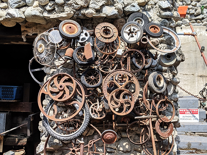 One person's junk is another's architectural masterpiece. This wall of recycled wheels and gears proves that beauty truly is in the eye of the builder.