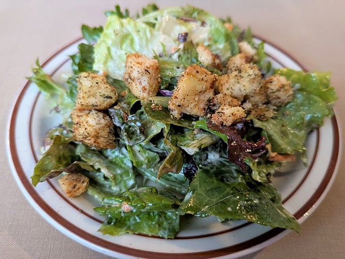 A salad that doesn't apologize for being a salad. Those seasoned croutons aren't just participating—they're making a statement.