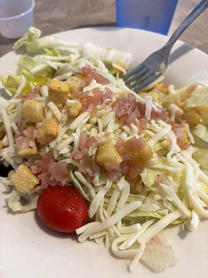 A salad that actually satisfies. Those croutons aren't afterthoughts—they're buttery little thrones for the fresh ingredients surrounding them.