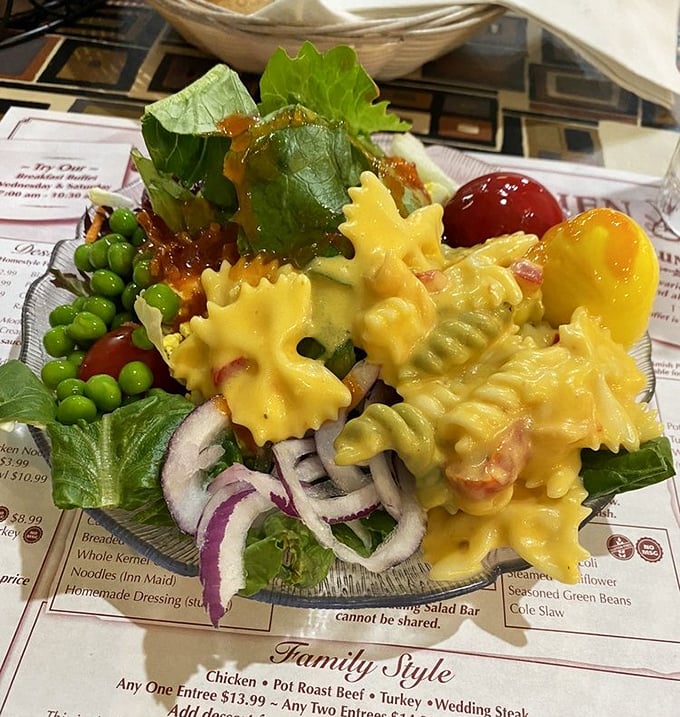 This pasta salad isn't just a side dish – it's a vibrant celebration on a bed of greens, where every bite invites you to the party.