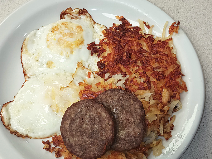 Eggs, sausage, and hash browns—the holy trinity of breakfast done right. No innovation needed when perfection was achieved decades ago.