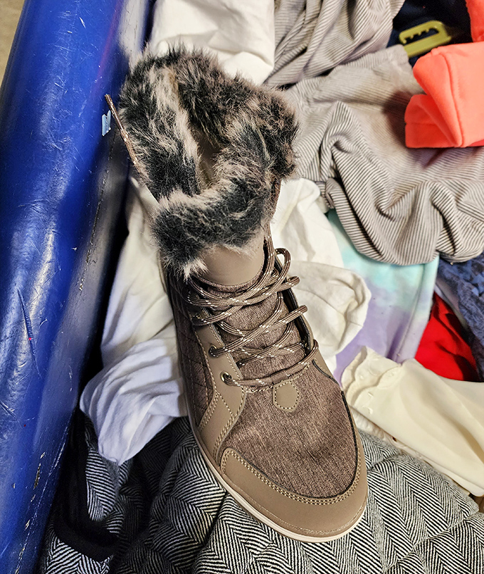 Fuzzy-topped winter boot making a surprise appearance in summer. Like finding an unexpected old friend at a party, it's waiting for the right shopper.