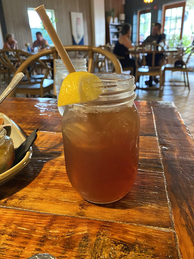 Sweet tea served in a mason jar with a paper straw—because in the South, tea isn't just a beverage, it's practically a religion.