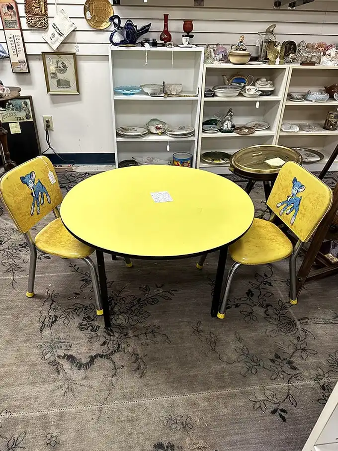 This sunshine-yellow children's table set doesn't just furnish a room—it transports you straight back to Saturday morning cartoons and Bambi-themed childhoods.