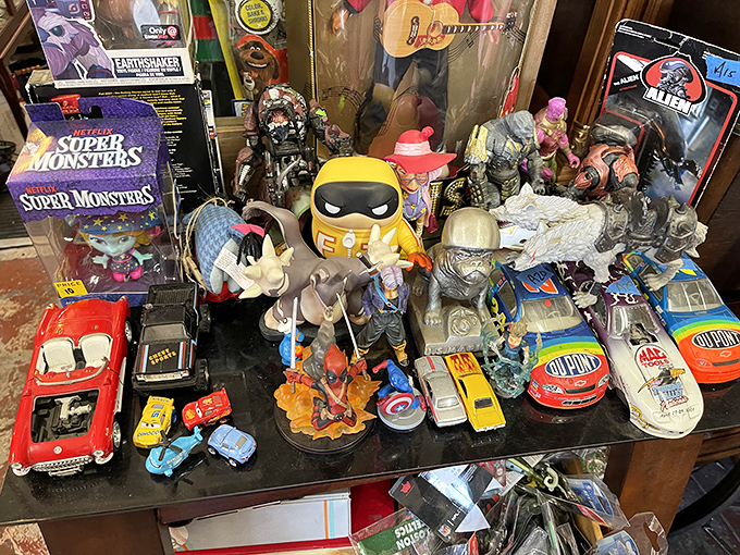 Action figures, collectibles, and childhood memories arranged in beautiful chaos—one person's decluttering becomes another's nostalgic jackpot.