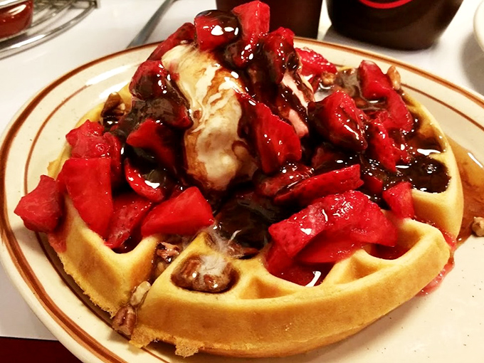 This waffle isn't just breakfast, it's dessert's morning cousin—topped with strawberries so fresh they're practically introducing themselves.