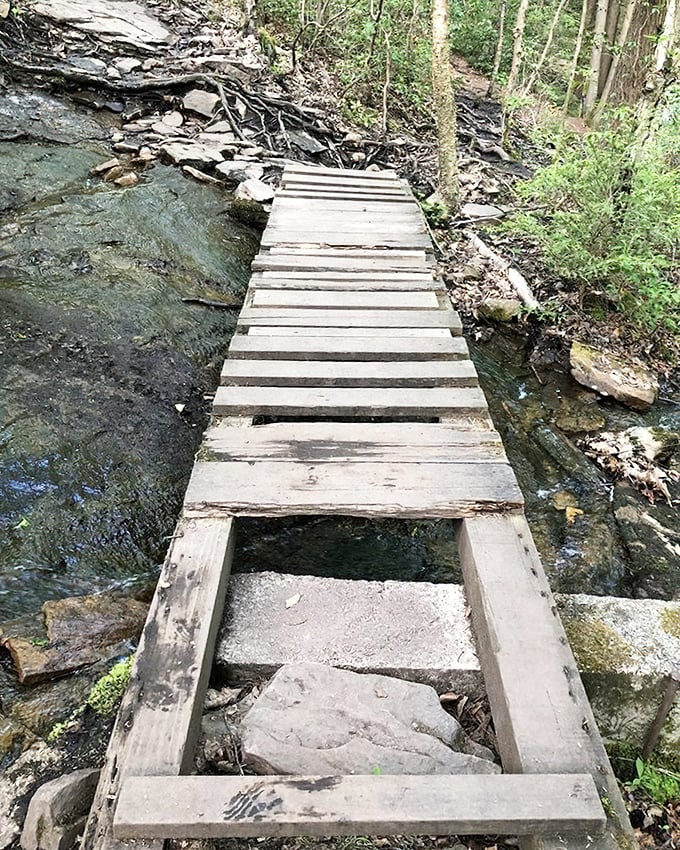This humble wooden bridge might not look Instagram-worthy, but it's your gateway to some of Pennsylvania's most magical water features.