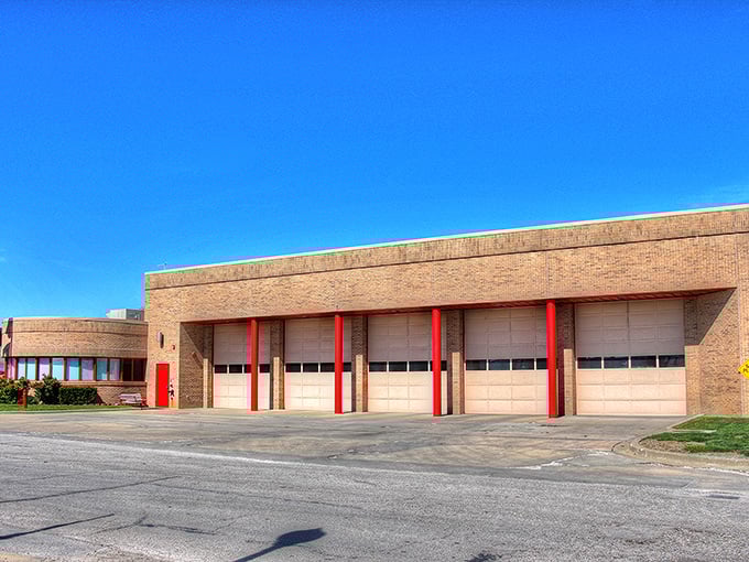Red brick fire station stands ready like a dependable neighbor you can count on.