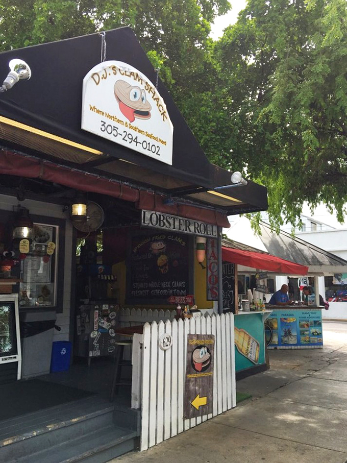 DJ's tiny storefront and white picket fence create the perfect Key West contradiction—small space, enormous flavors.