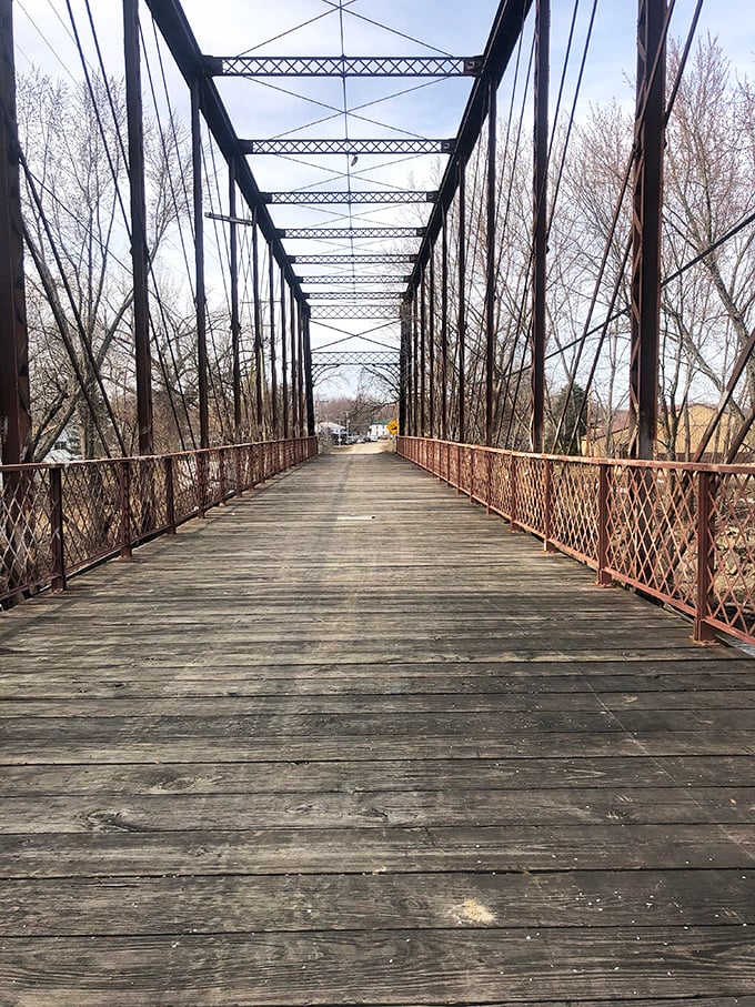 Classic bridge spans more than just a creek—it connects the community to endless outdoor possibilities. Engineering that's stood the test of time!